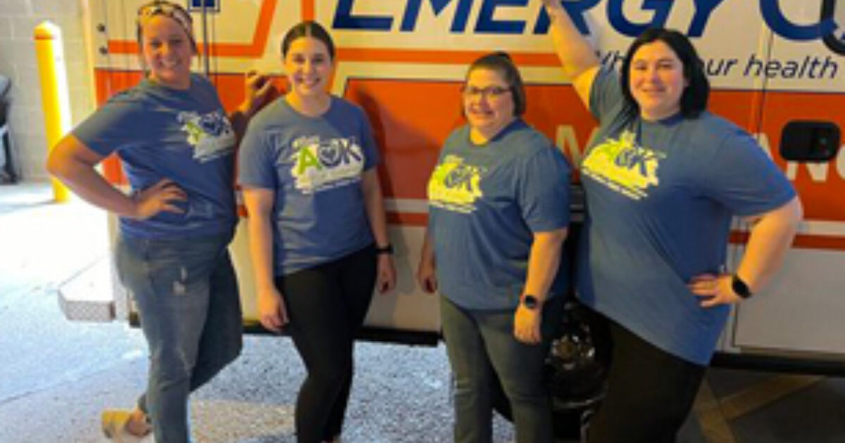 Helping out at the EmergyCare Garage Gala 2024 | Erie FCU